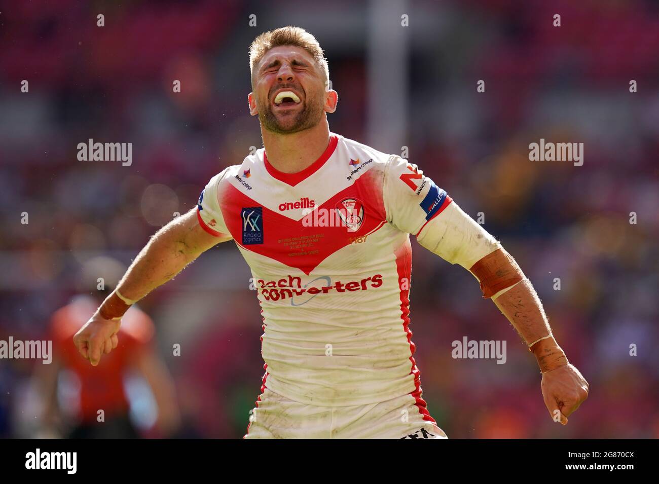 St Helens' Tommy Makinson celebrates just before the end of the game ...