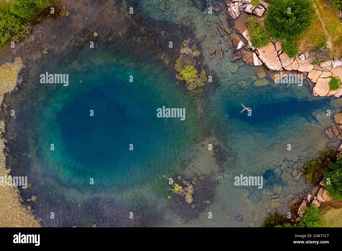 Aerial viev woman swimming hi-res stock photography and images - Alamy