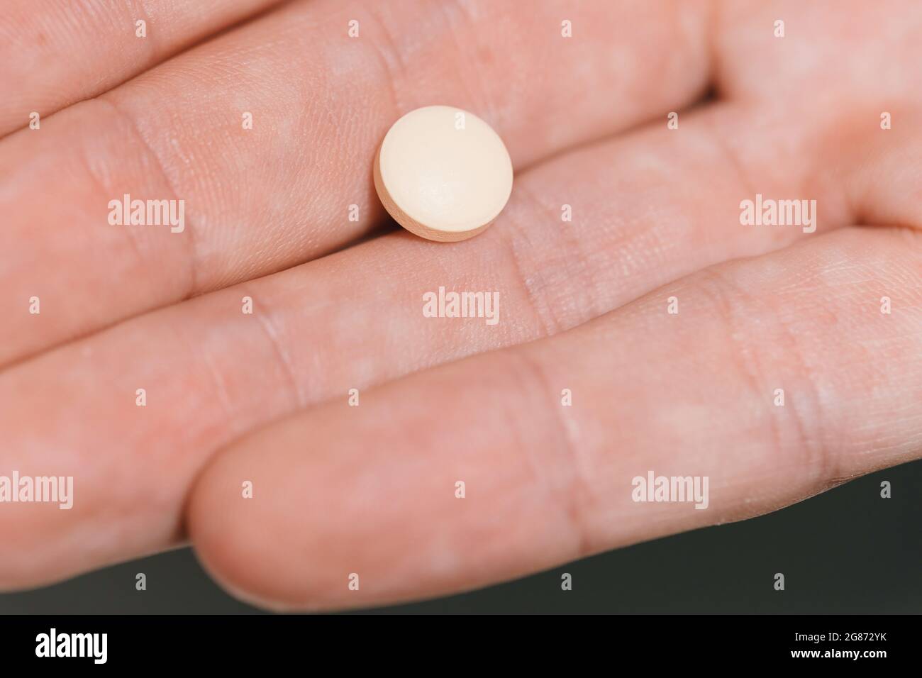 close up. white pill into the palm. photo with a copy-space Stock Photo ...