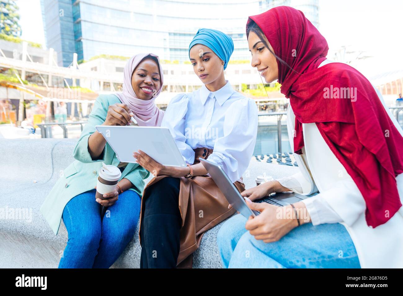 Multiethnic group of muslim girls wearing casual clothes and ...