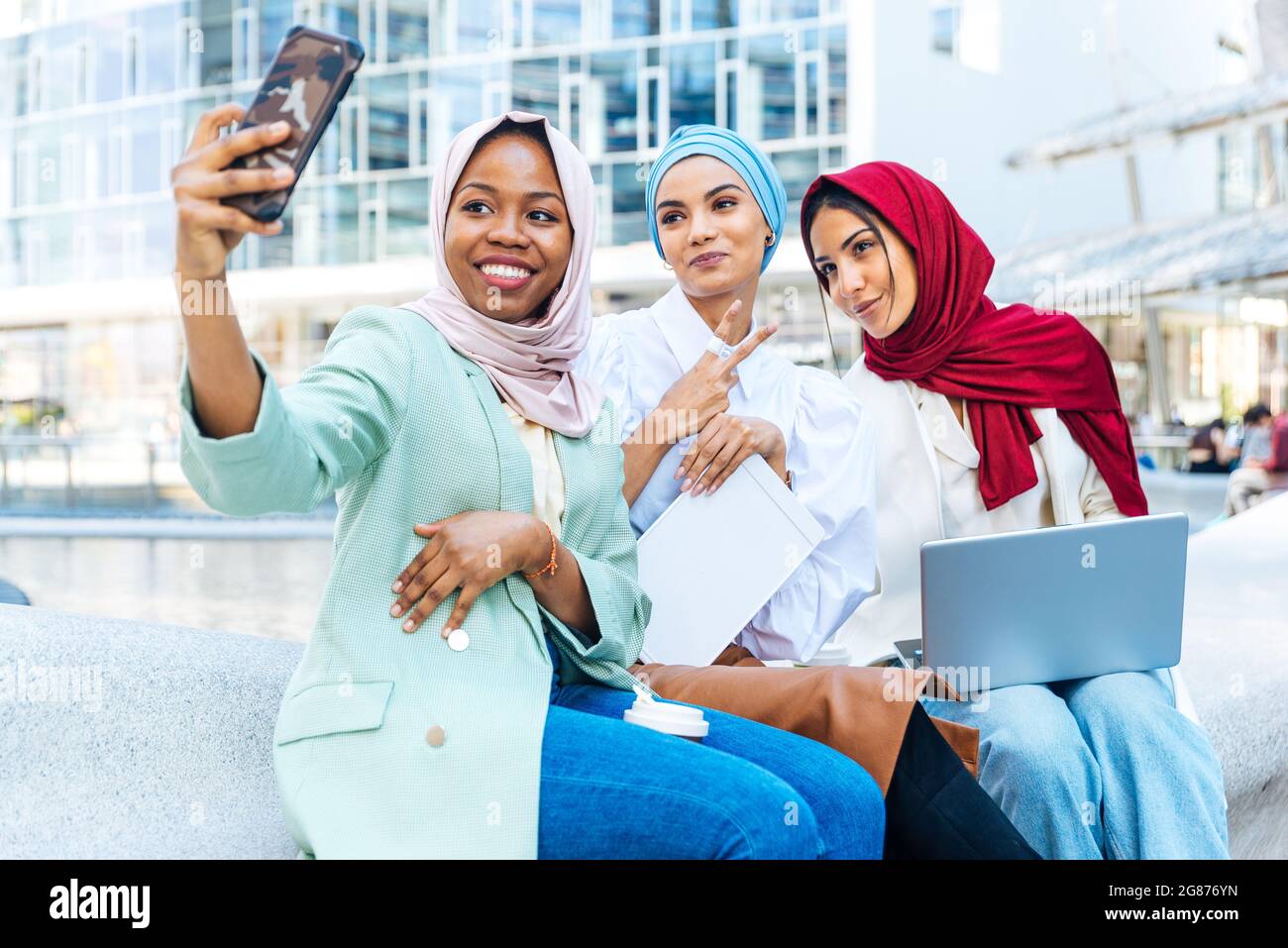 Multiethnic group of muslim girls wearing casual clothes and ...