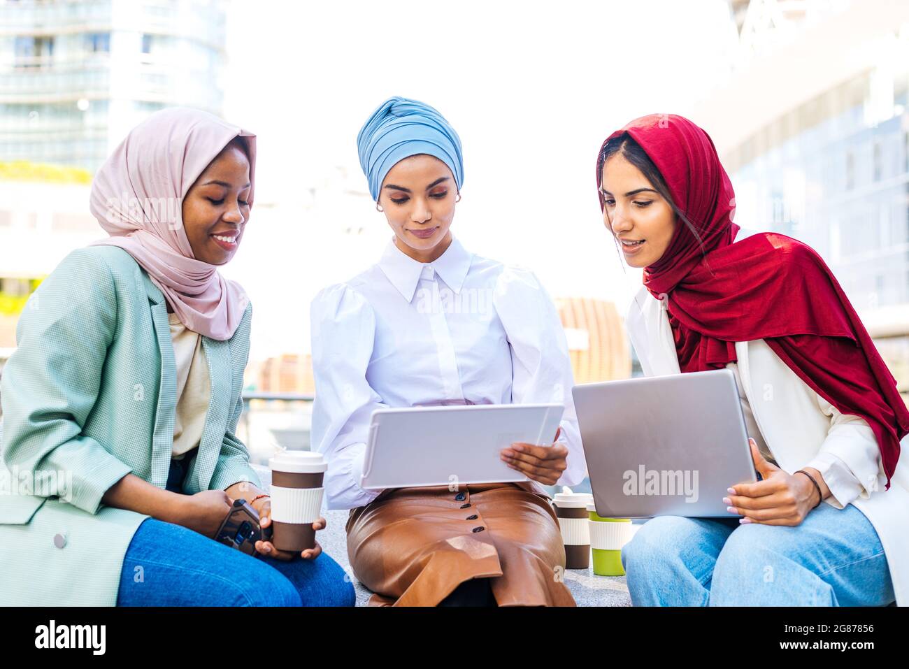 Multiethnic group of muslim girls wearing casual clothes and ...