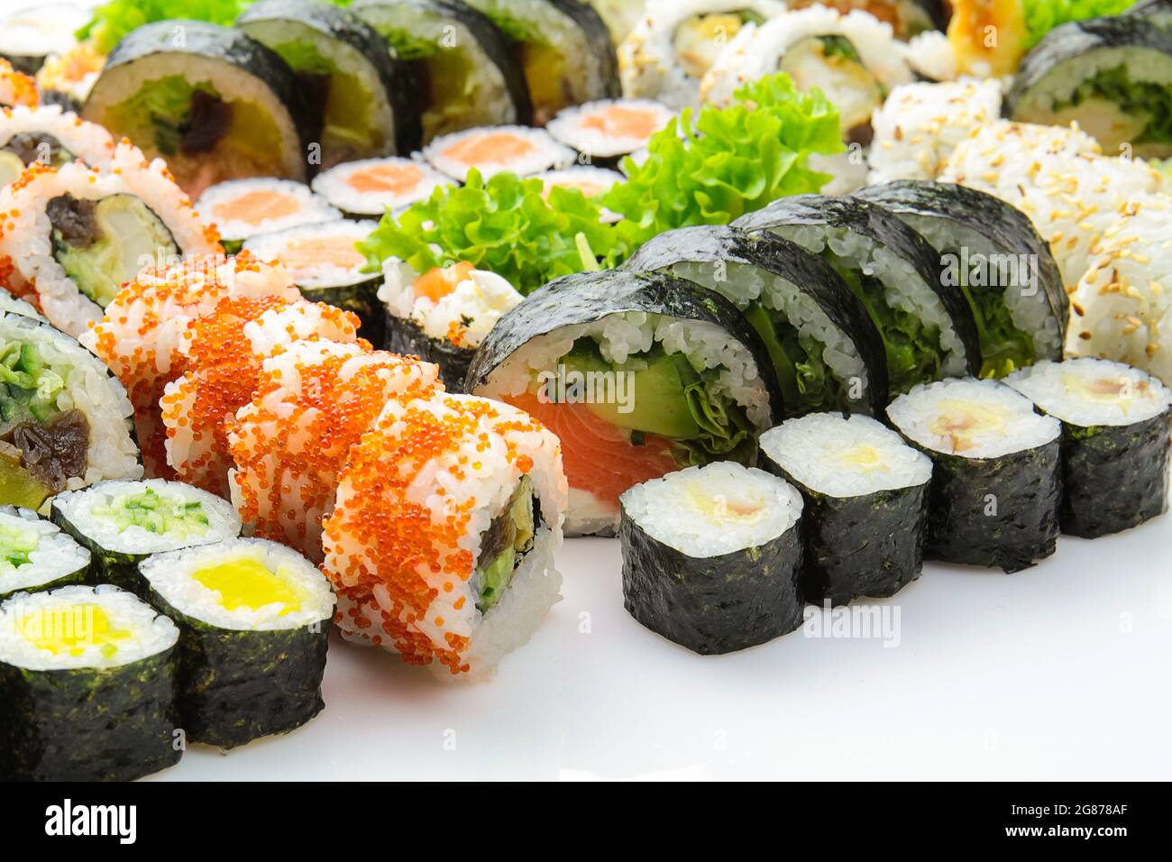 Closeup of sushi set maki on a white table Stock Photo - Alamy