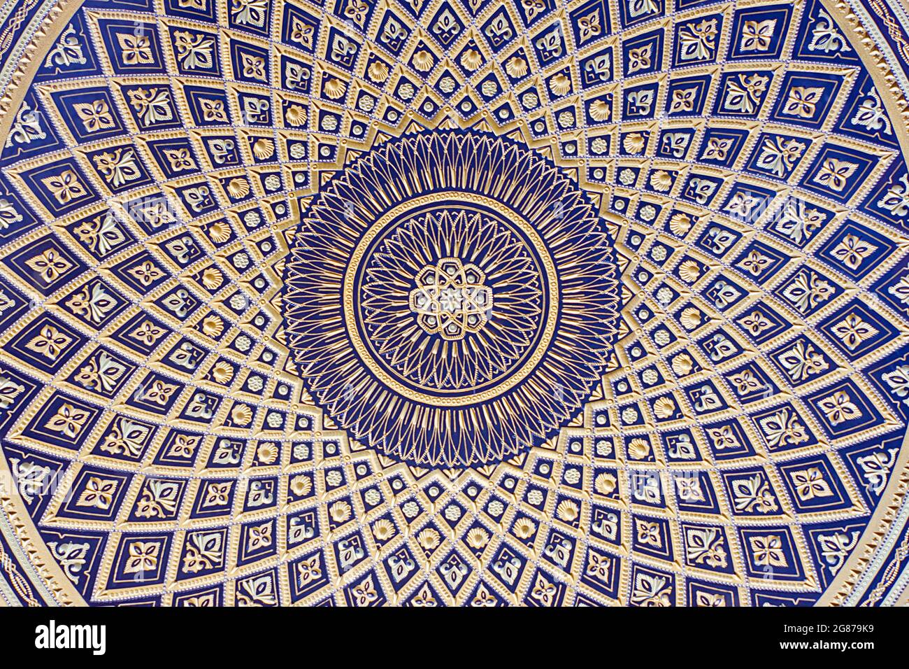 Top view of a decorative plate with blue and golden patterns Stock ...