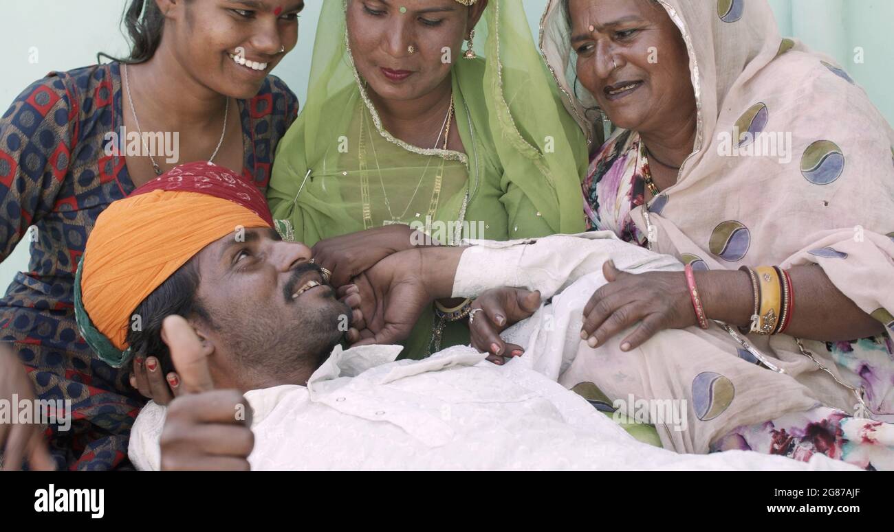 Group of South Asian people in traditional clothing having fun together ...