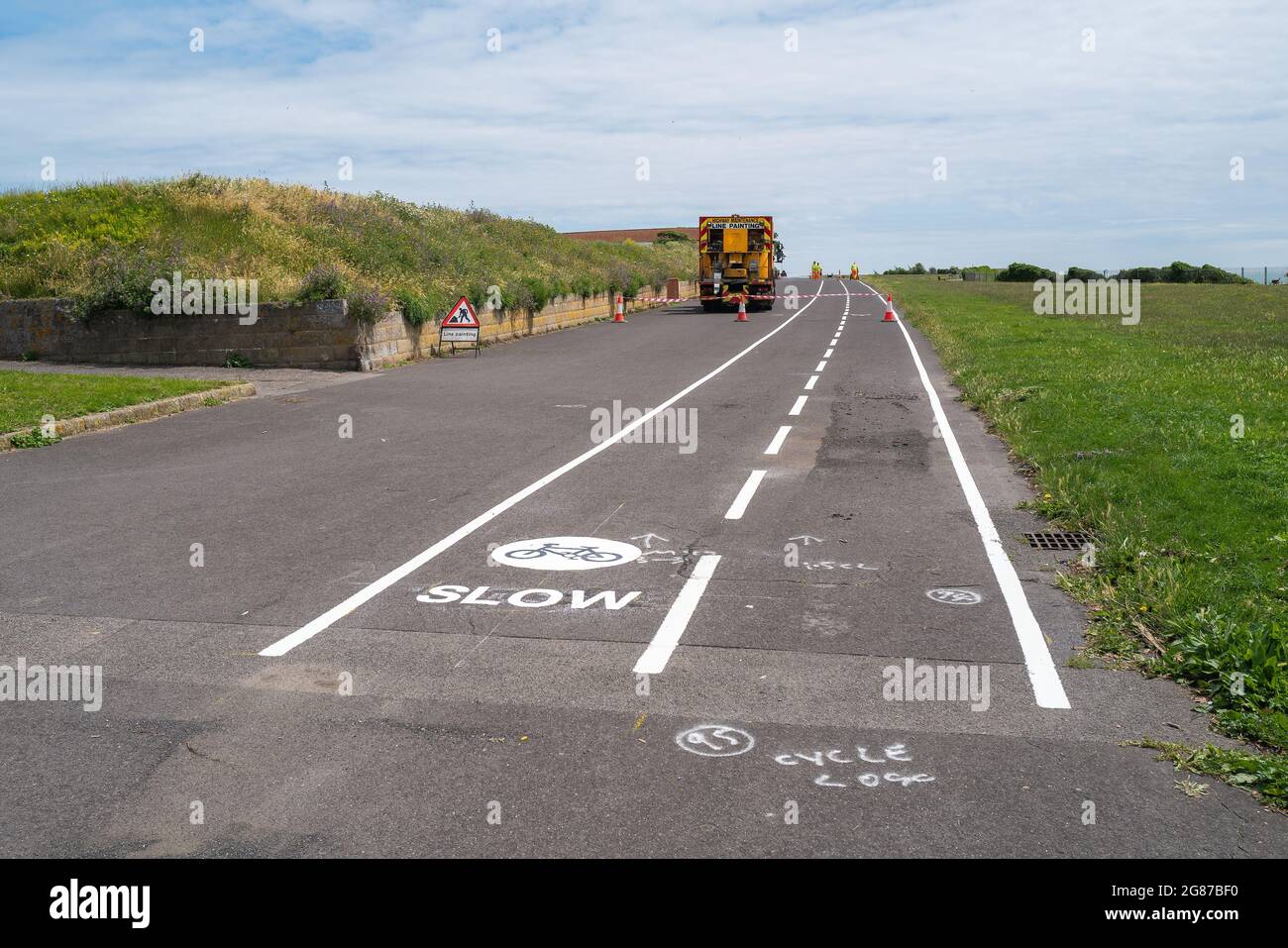 Newly painted cycle path lanes. The workman and truck can still be seen ...