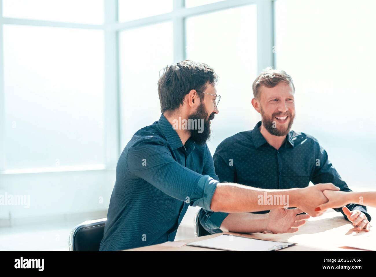 Interviewer handshaking the applicant hi-res stock photography and ...