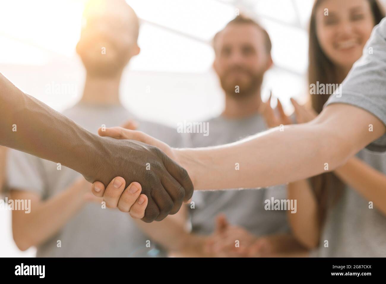 close up. handshake of two students on the background of the student ...