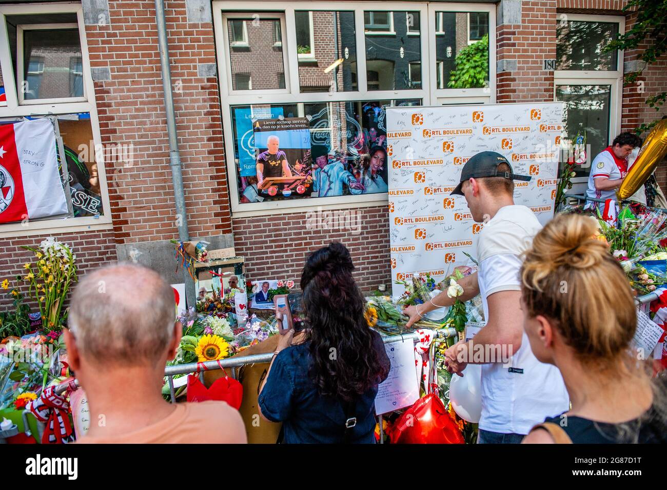 Amsterdam, Netherlands. 17th July, 2021. A man is seen placing flowers ...