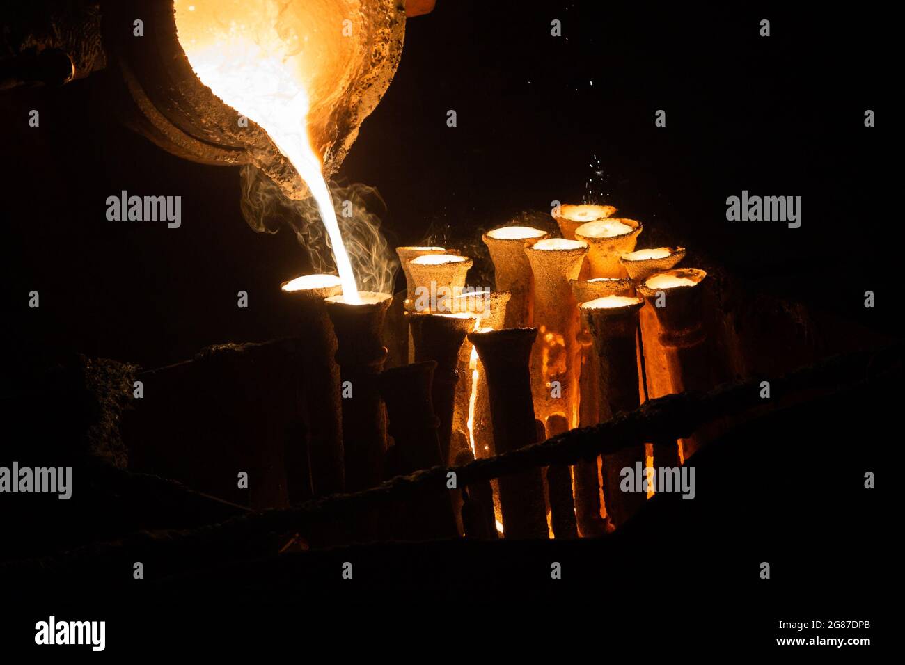 Industrial lost wax casting. The process of pouring for filling out ...