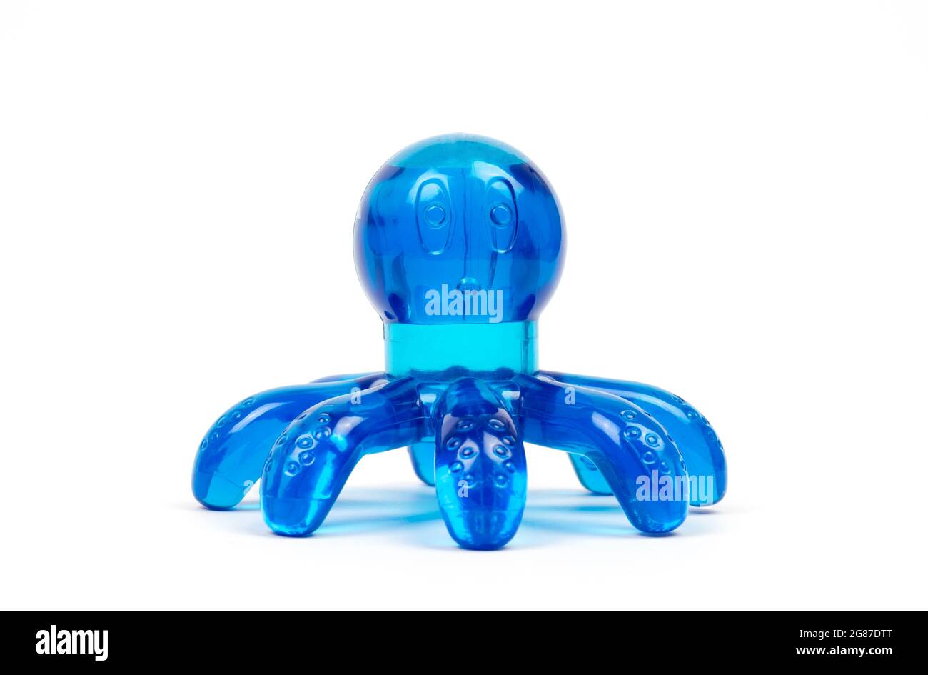 Body massager in the shape of an octopus. Blue plastic body massager on ...