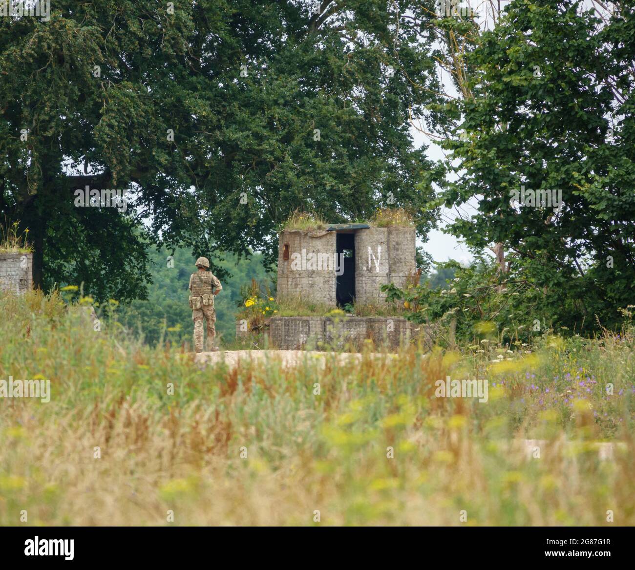 British army soldier on duty standing guard with SA80 rifle in hand ...