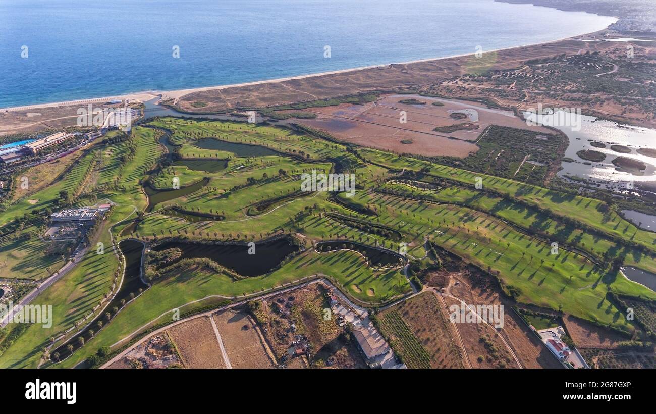 Green golf courses by the sea. Salgados beach. Portugal, Albufeira ...