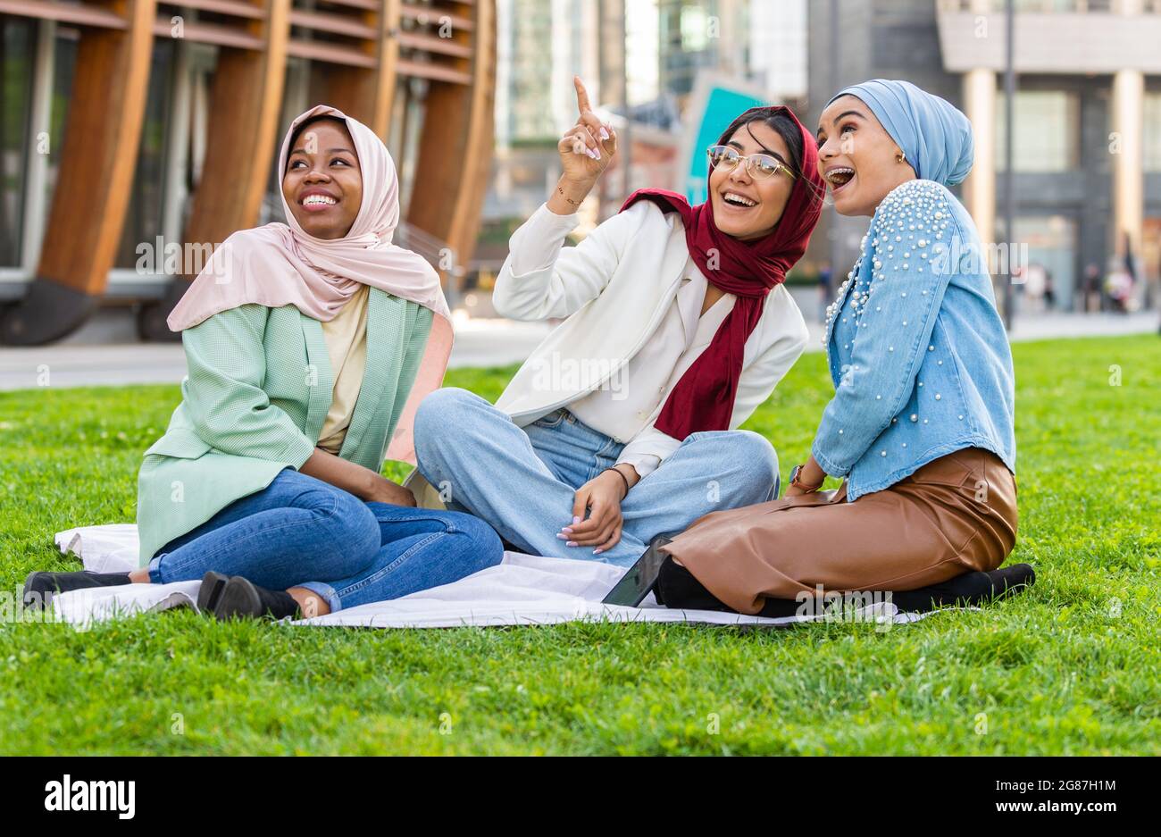 Multiethnic group of muslim girls wearing casual clothes and ...