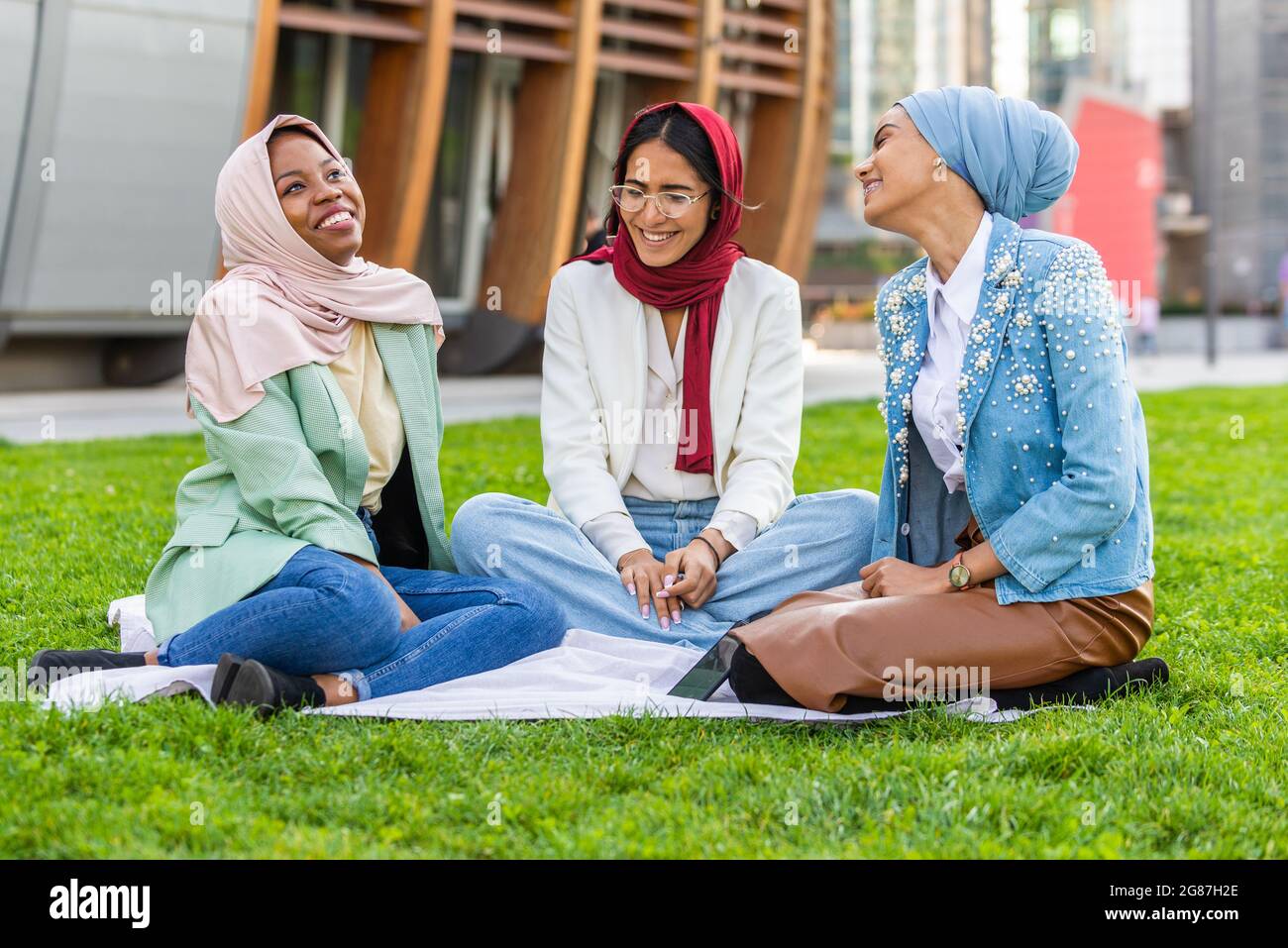Multiethnic group of muslim girls wearing casual clothes and ...