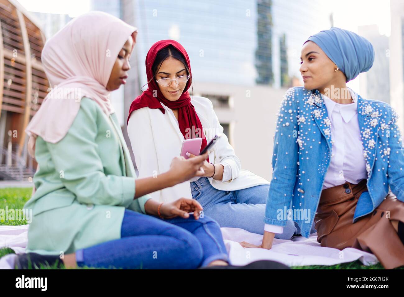 Multiethnic group of muslim girls wearing casual clothes and ...
