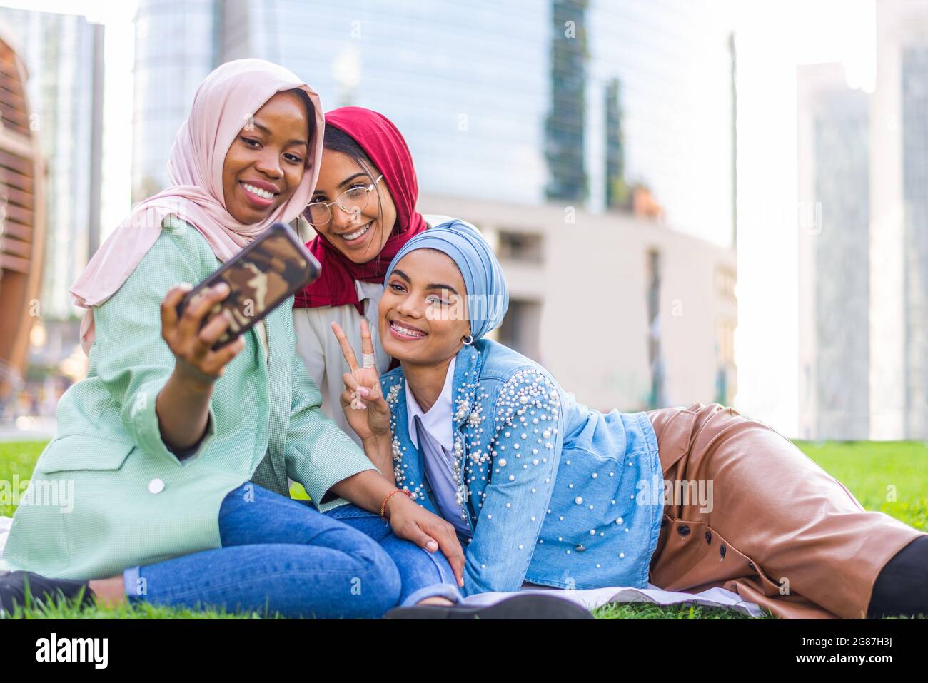 Multiethnic group of muslim girls wearing casual clothes and ...