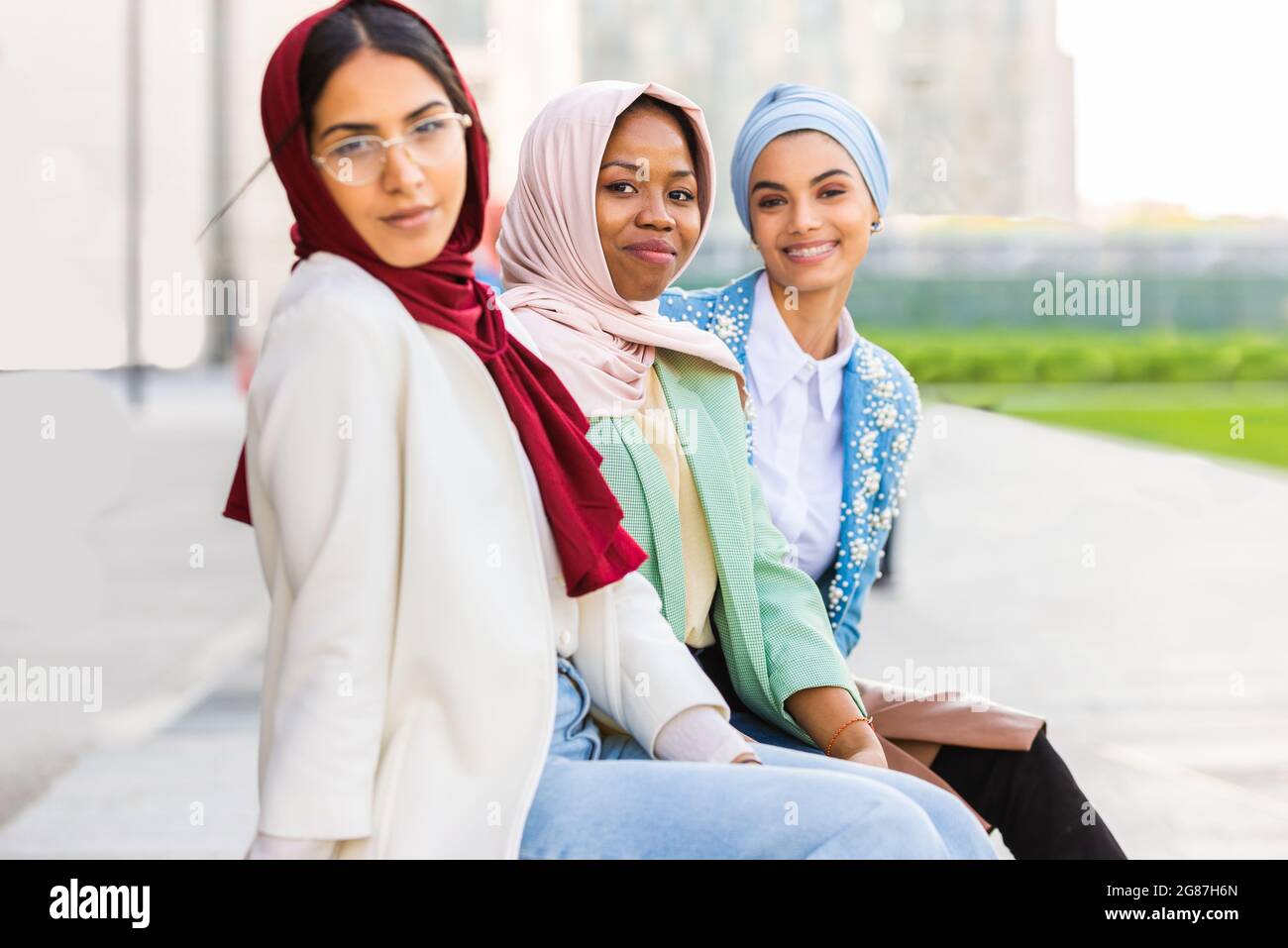 Multiethnic group of muslim girls wearing casual clothes and ...