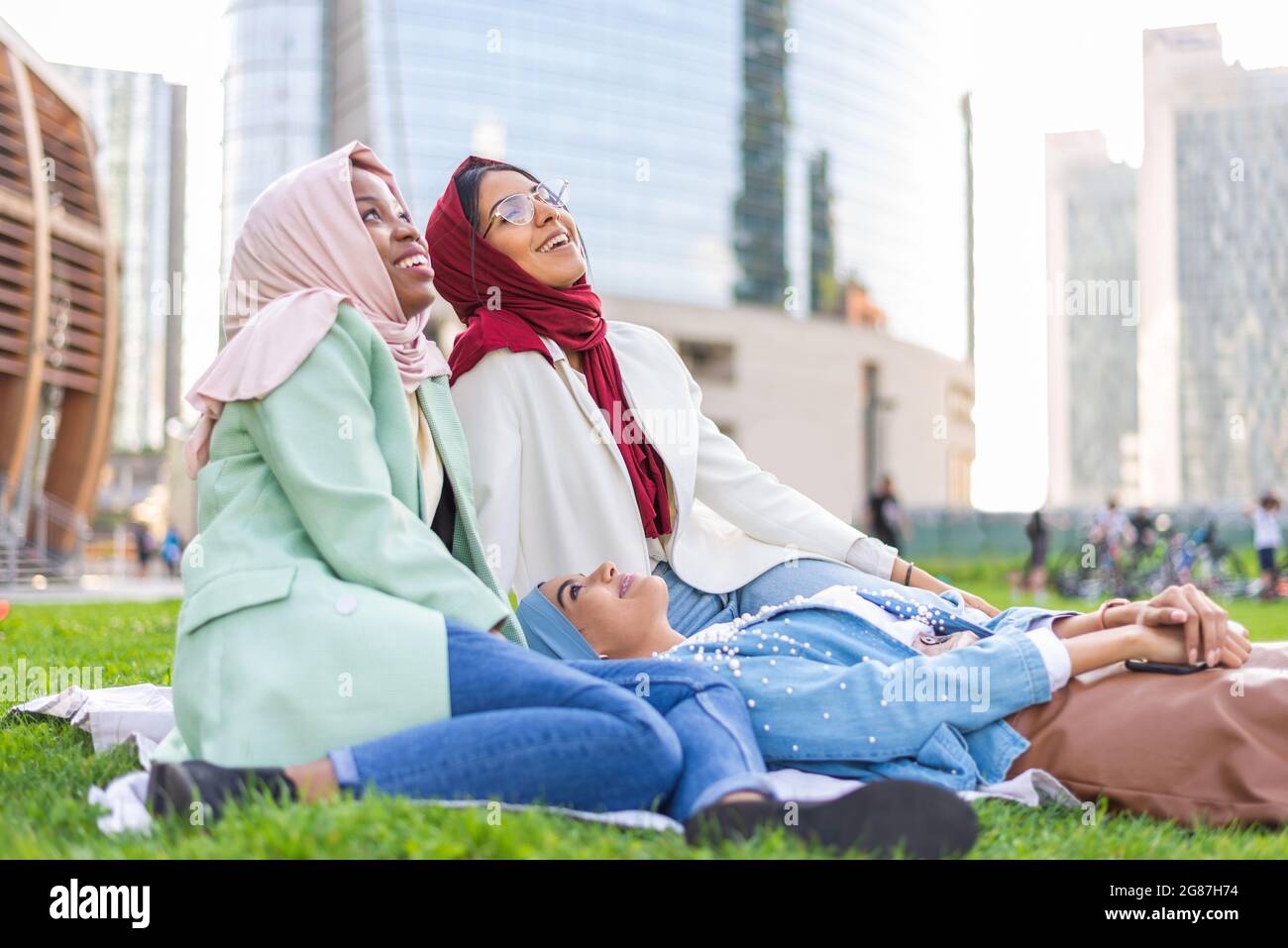 Multiethnic group of muslim girls wearing casual clothes and ...
