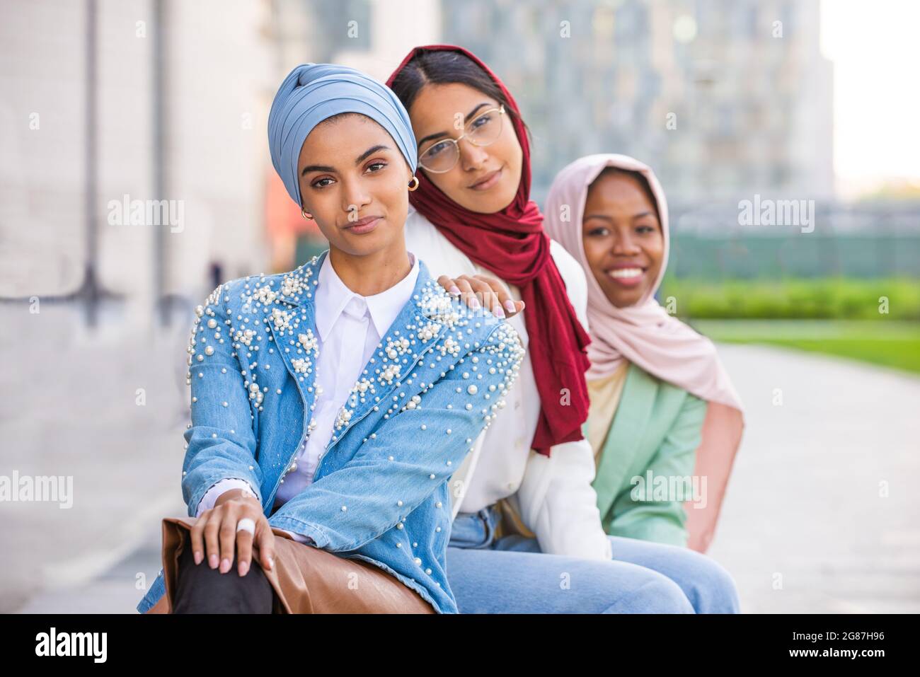 Multiethnic group of muslim girls wearing casual clothes and ...
