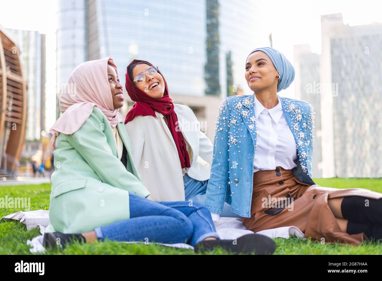 Multiethnic group of muslim girls wearing casual clothes and ...