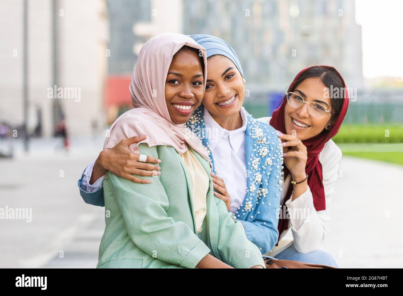 Multiethnic group of muslim girls wearing casual clothes and ...