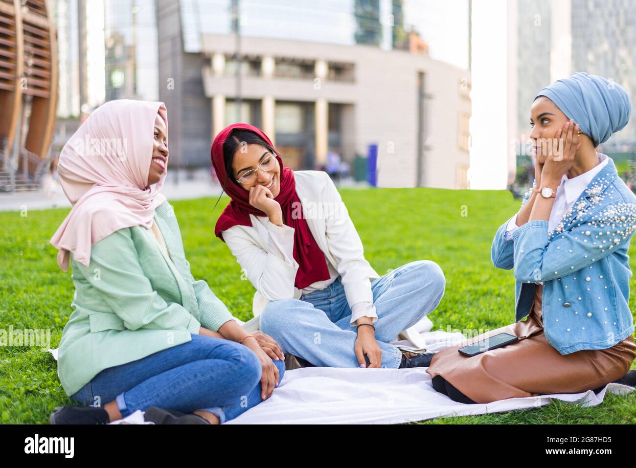 Multiethnic group of muslim girls wearing casual clothes and ...