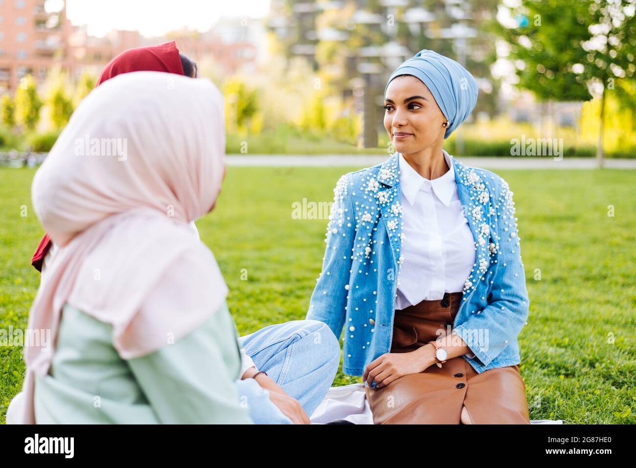 Multiethnic group of muslim girls wearing casual clothes and ...