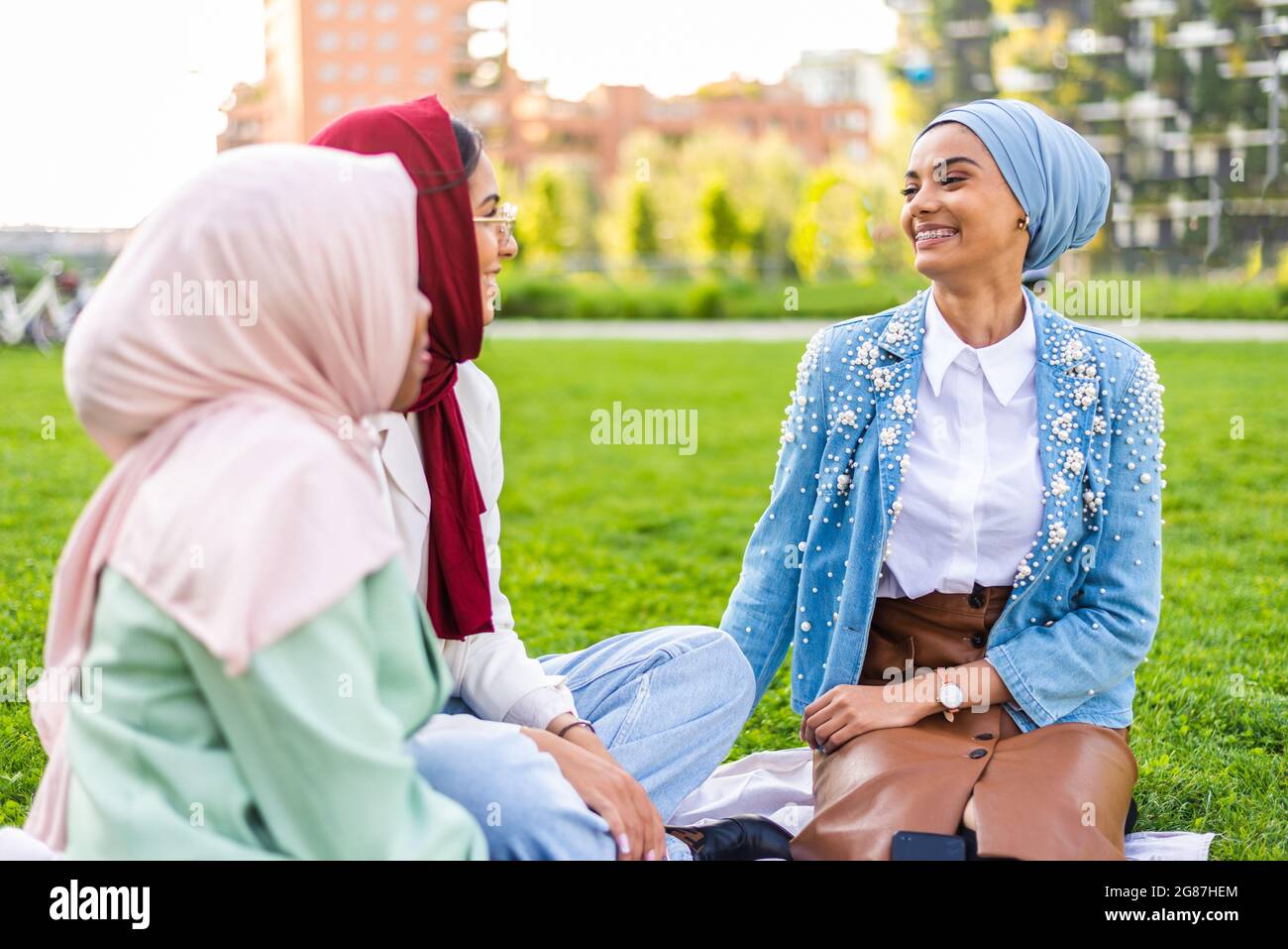 Multiethnic group of muslim girls wearing casual clothes and ...