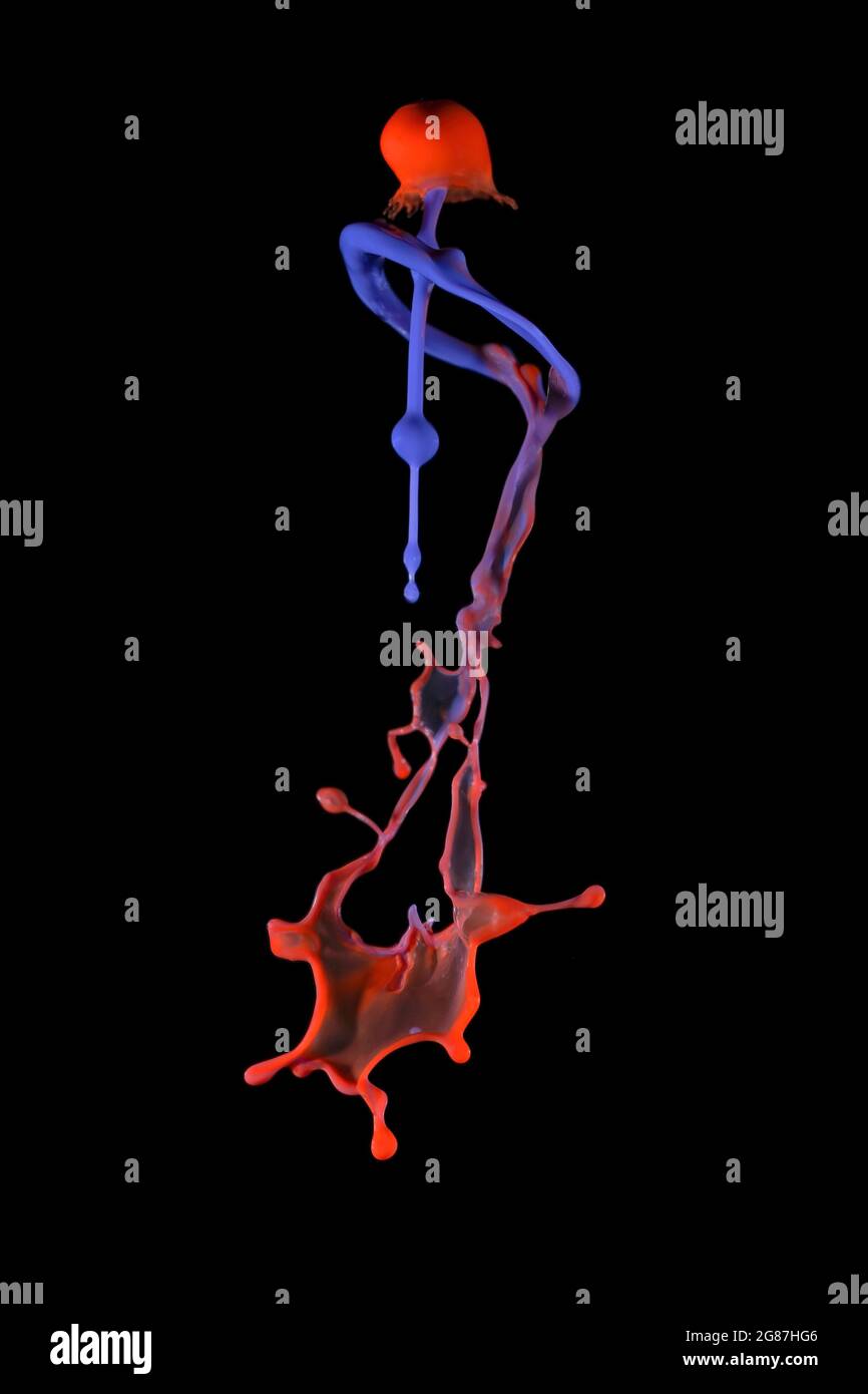 An out of control shape formed by water drops shot from above and below ...