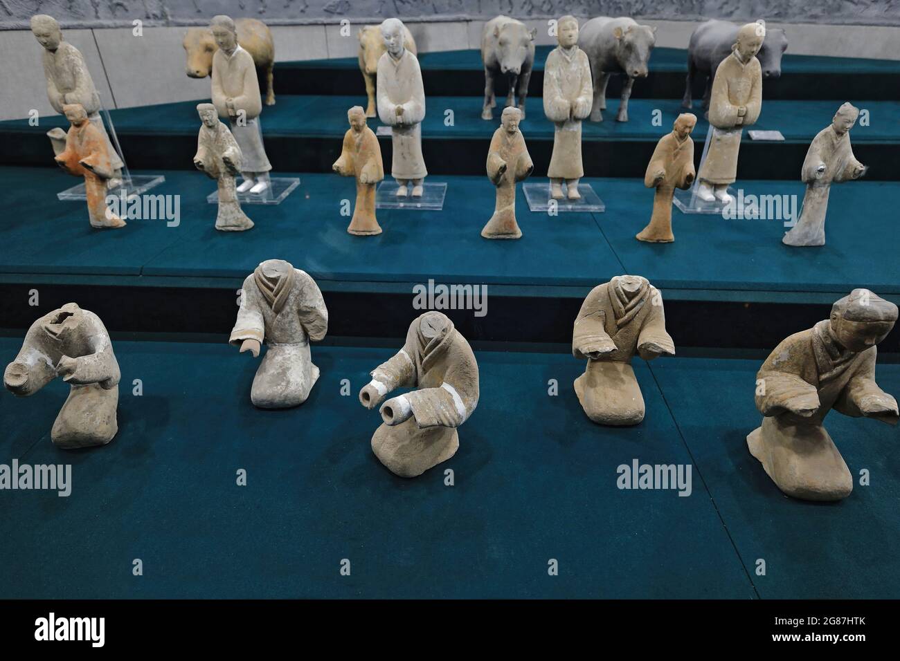 Terracotta funerary figurines of servants-courtiers-livestock. Han Yang ...