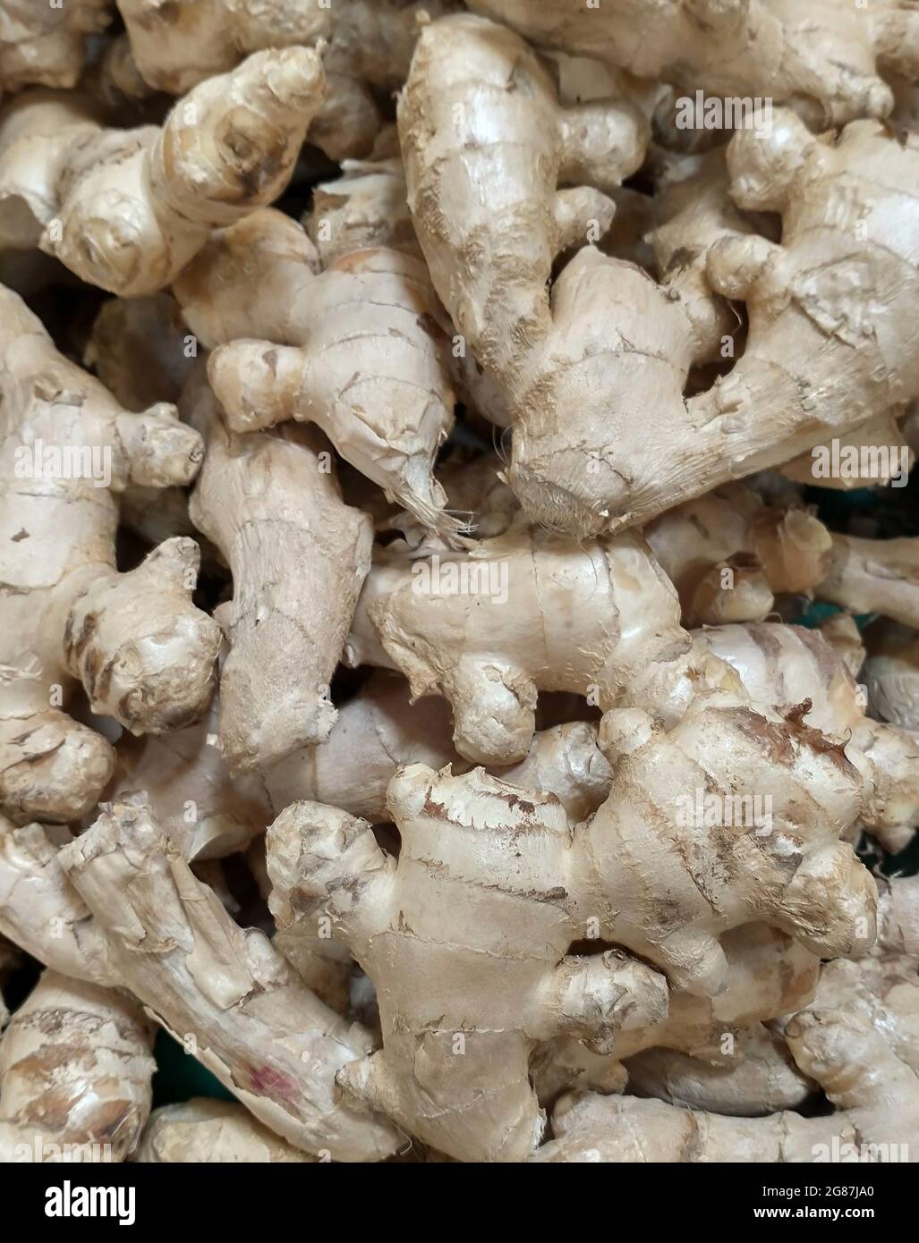 Whole Ginger in Market Stock Photo - Alamy