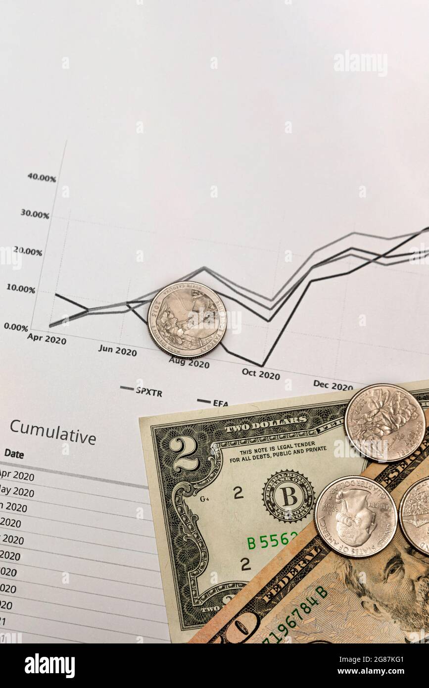 investment report, financial quarterly report, money on a printed sheet ...