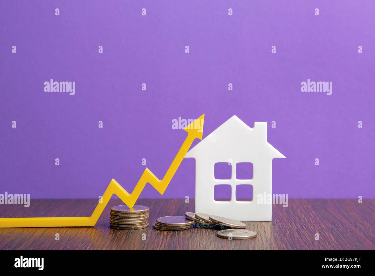 Real estate market, graph, up arrow. House construction model and a ...
