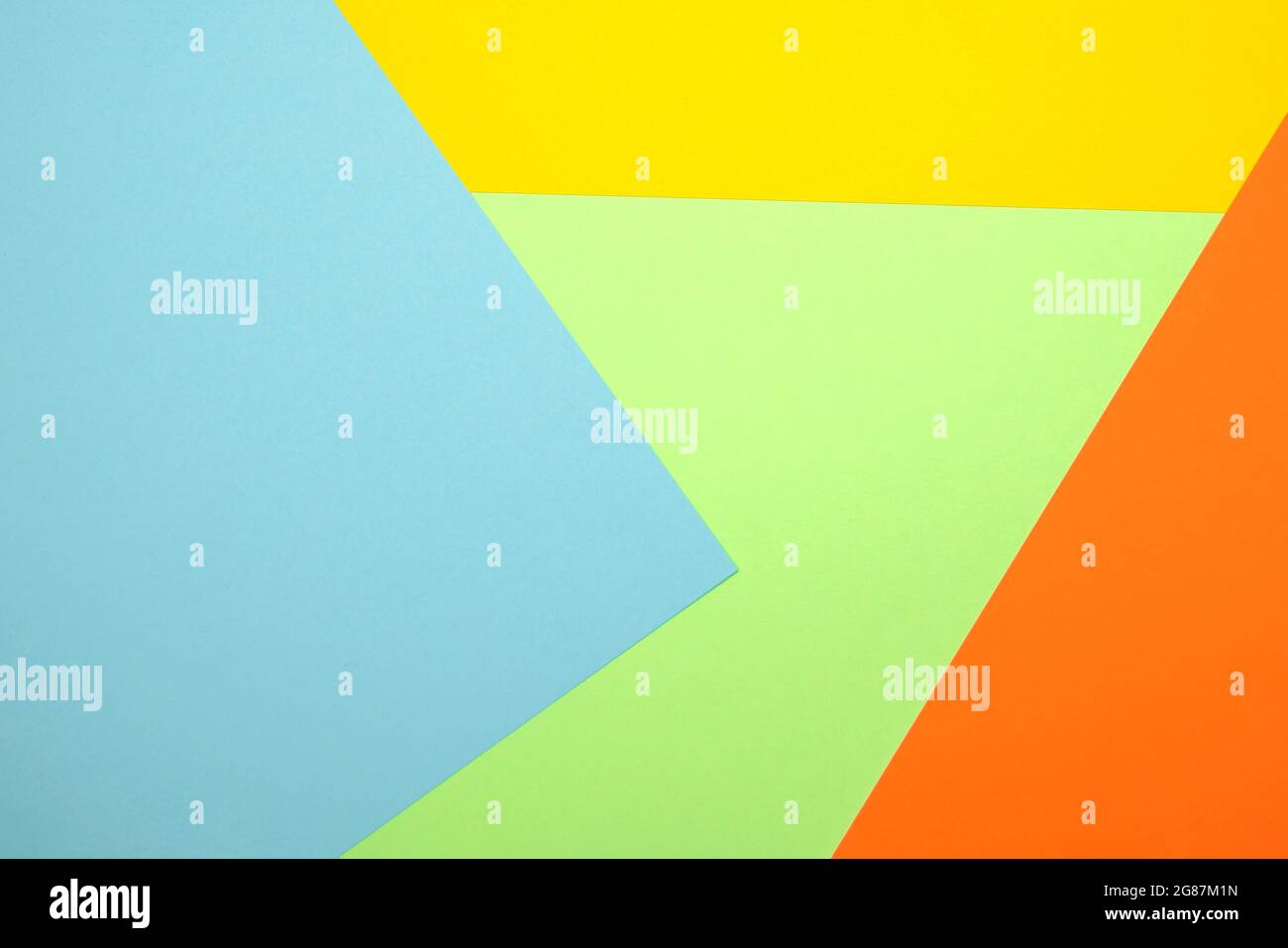 Colored triangles made of paper, colorful paper background in pastel ...