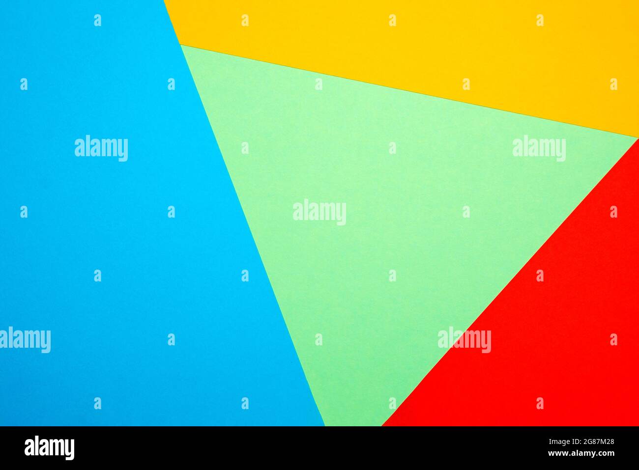 Colored triangles made of paper, colorful paper background in pastel ...