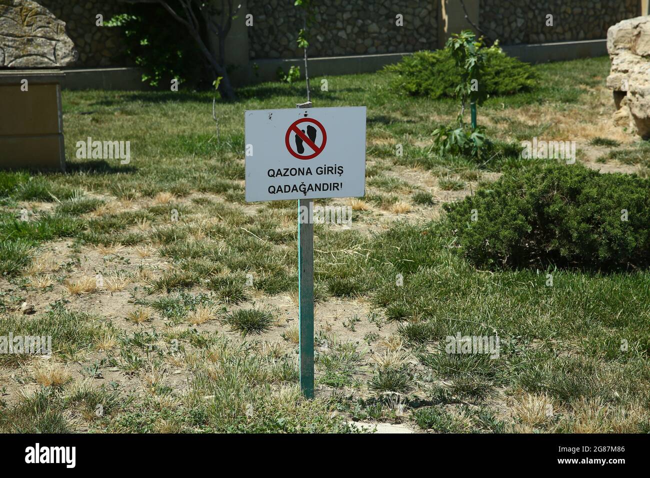 Signboard with the symbol don't walk on the grass . Road stop sign ...