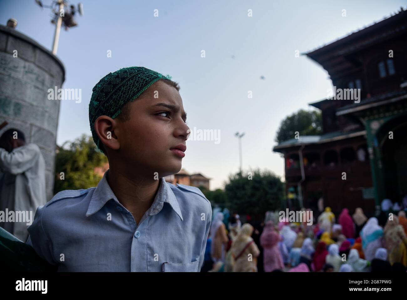 A Kashmiri boy looks on outside the shrine of Sufi Saint Syed Ali ...