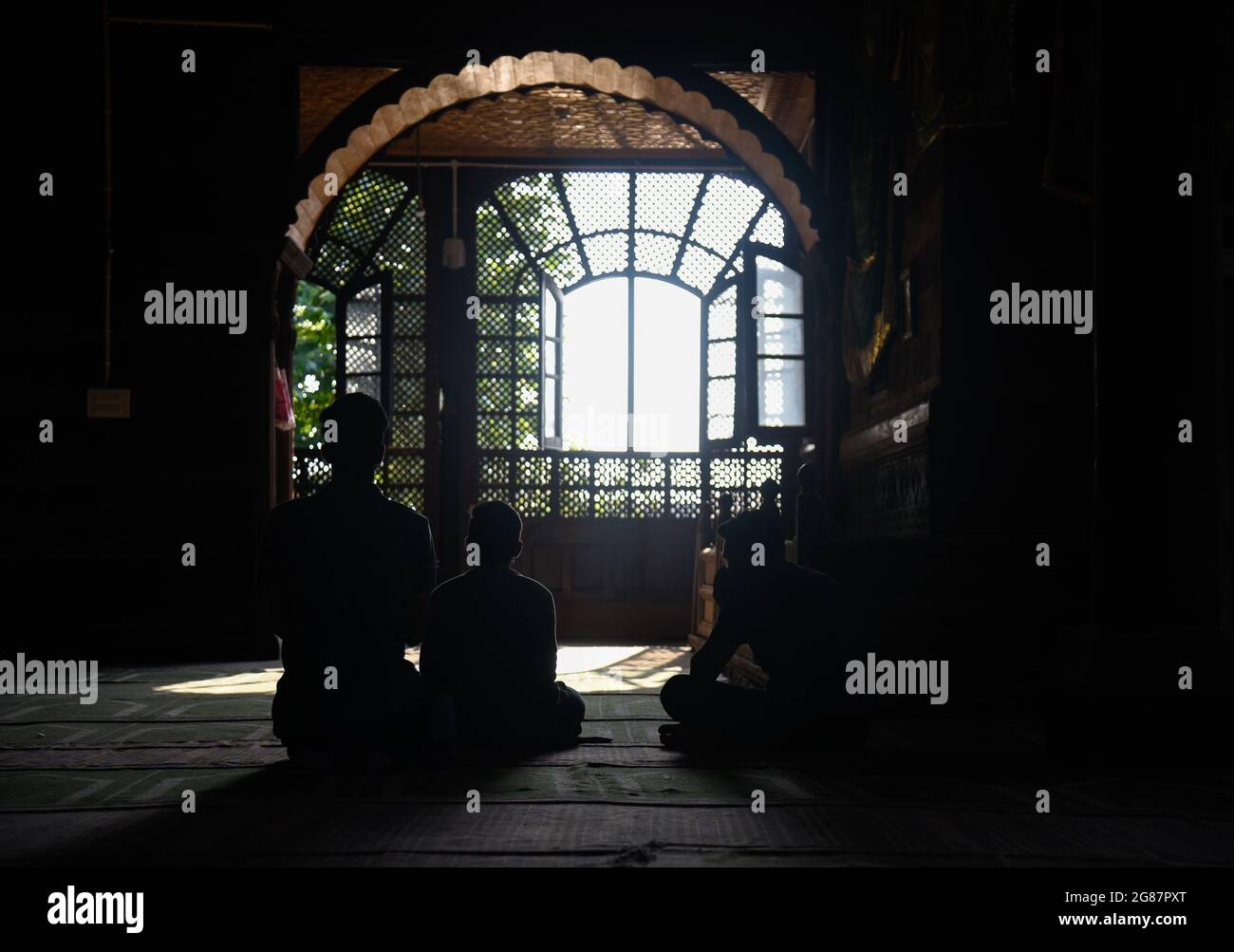 Srinagar, India. 17th July, 2021. Kashmiri Muslim devotees pray inside ...