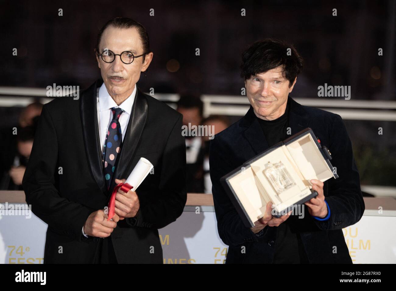 Russell Mael and Ron Mael pose with the Best Director Award in the name ...