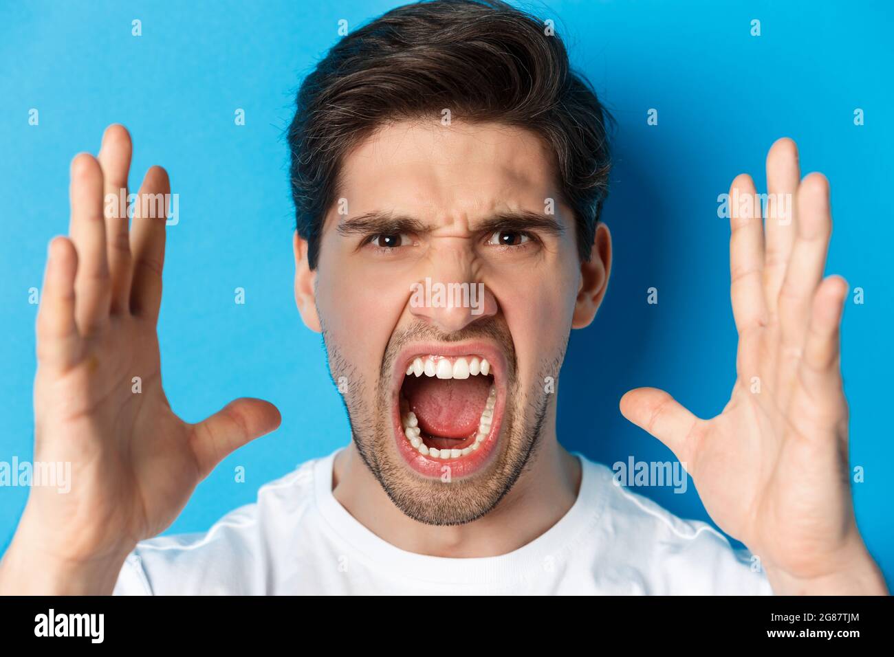 Headshot of man showing anger and frustration, yelling with outraged ...