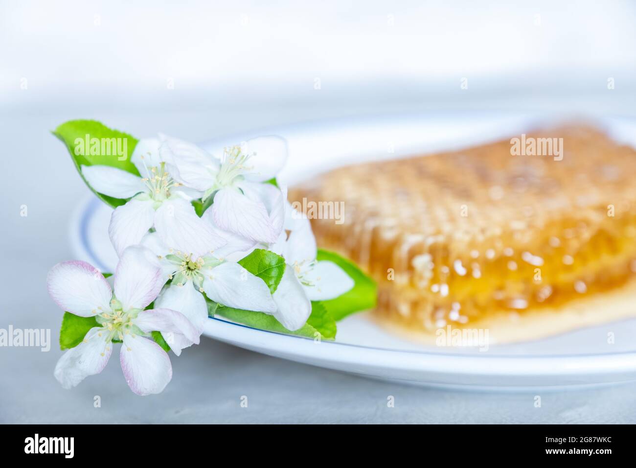 Natural honey with roses and citruses Stock Photo - Alamy