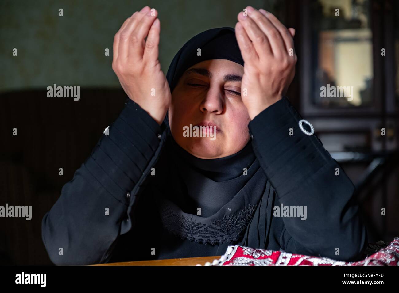 Muslim woman praying for Allah with her feelings of devotion and ...