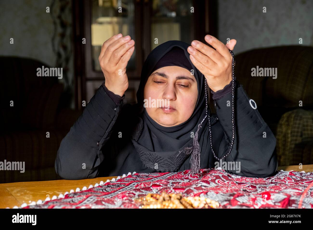 Muslim woman praying for Allah with her feelings of devotion and ...