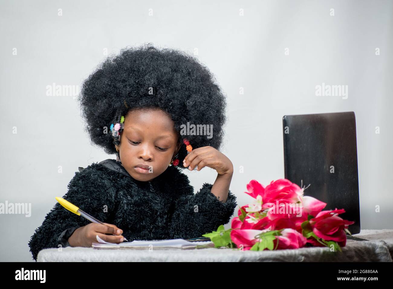 African child reading back view hi-res stock photography and images - Alamy