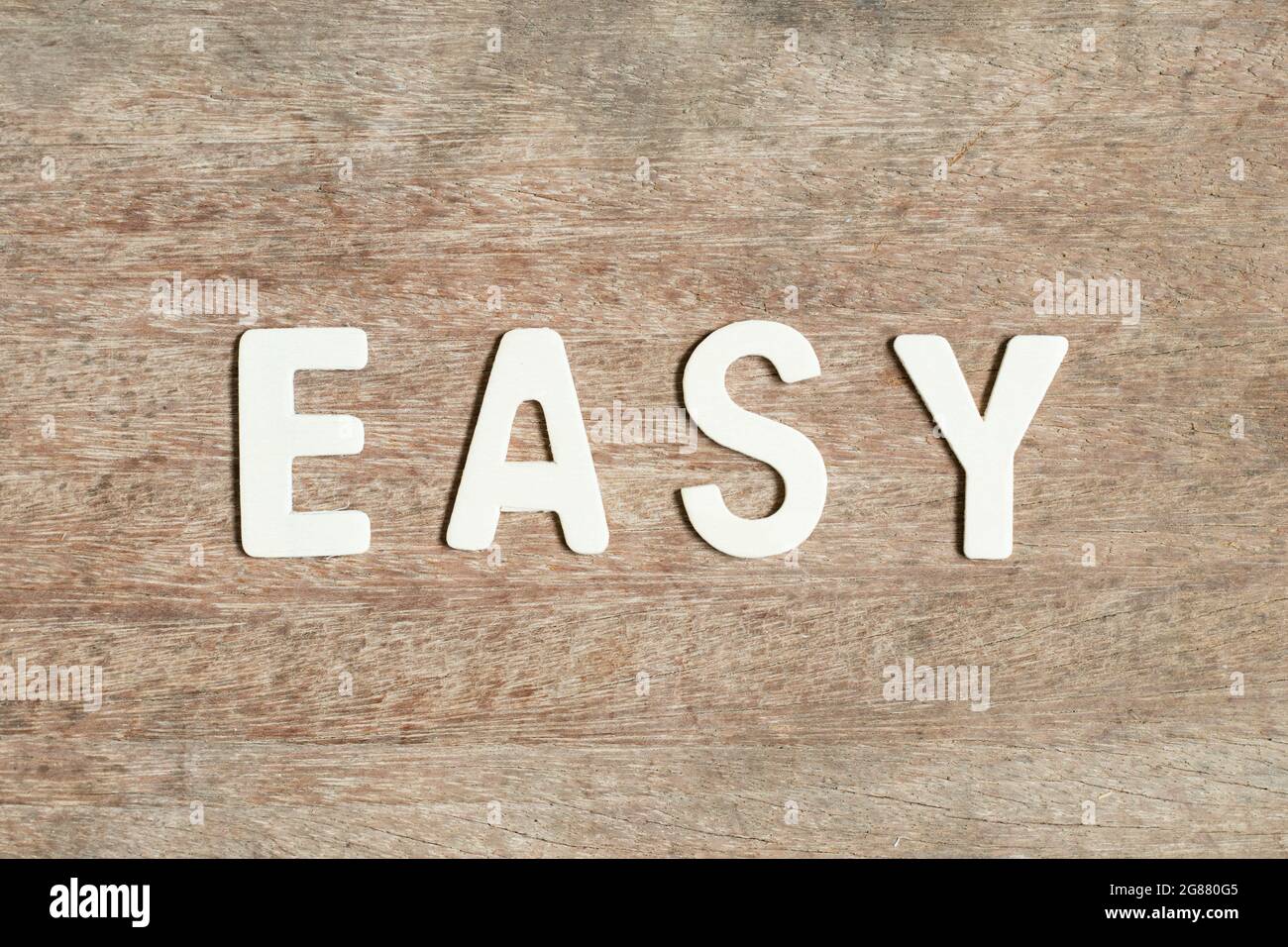 Alphabet letter in word easy on wood background Stock Photo - Alamy