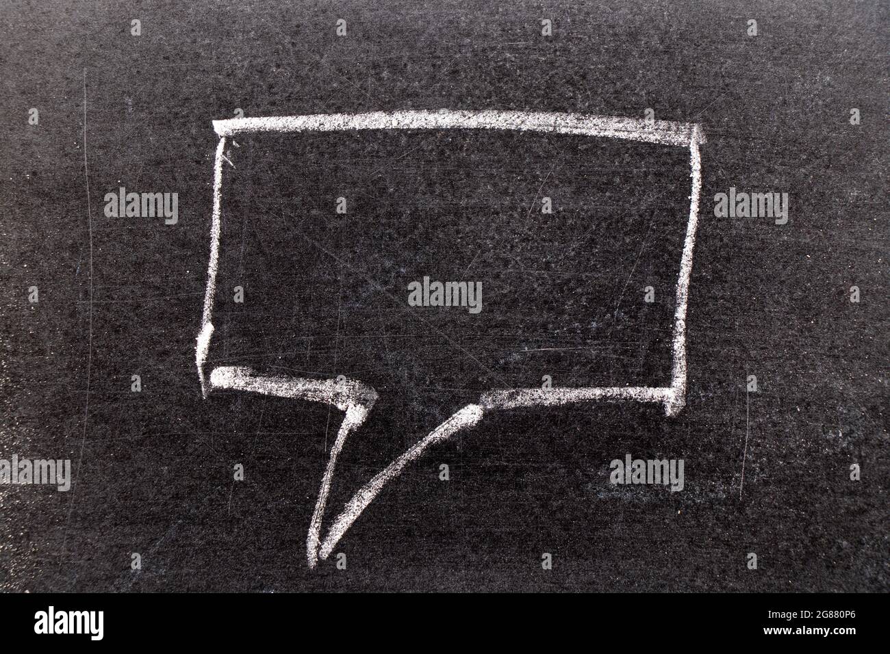White chalk hand drawing in bubble speech shape with blank space for ...