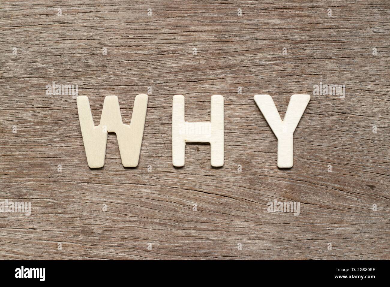 Alphabet letter in word why on wood background Stock Photo - Alamy