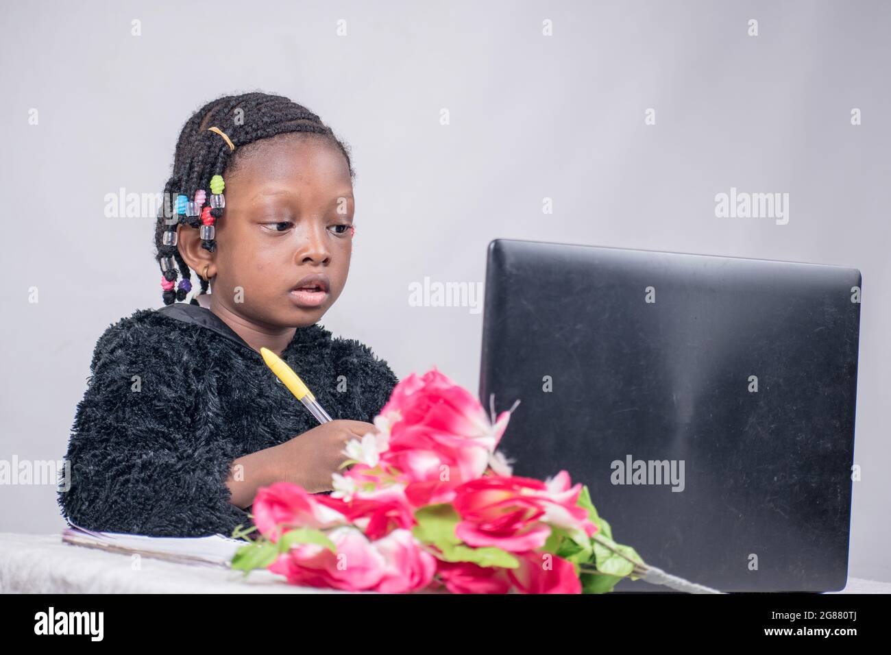 African girl child writing, studying, learning, and researching for ...