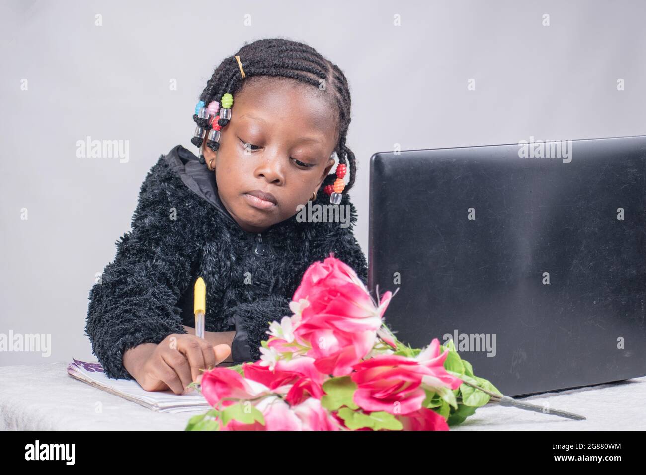 African girl child writing, studying, learning, and researching for ...